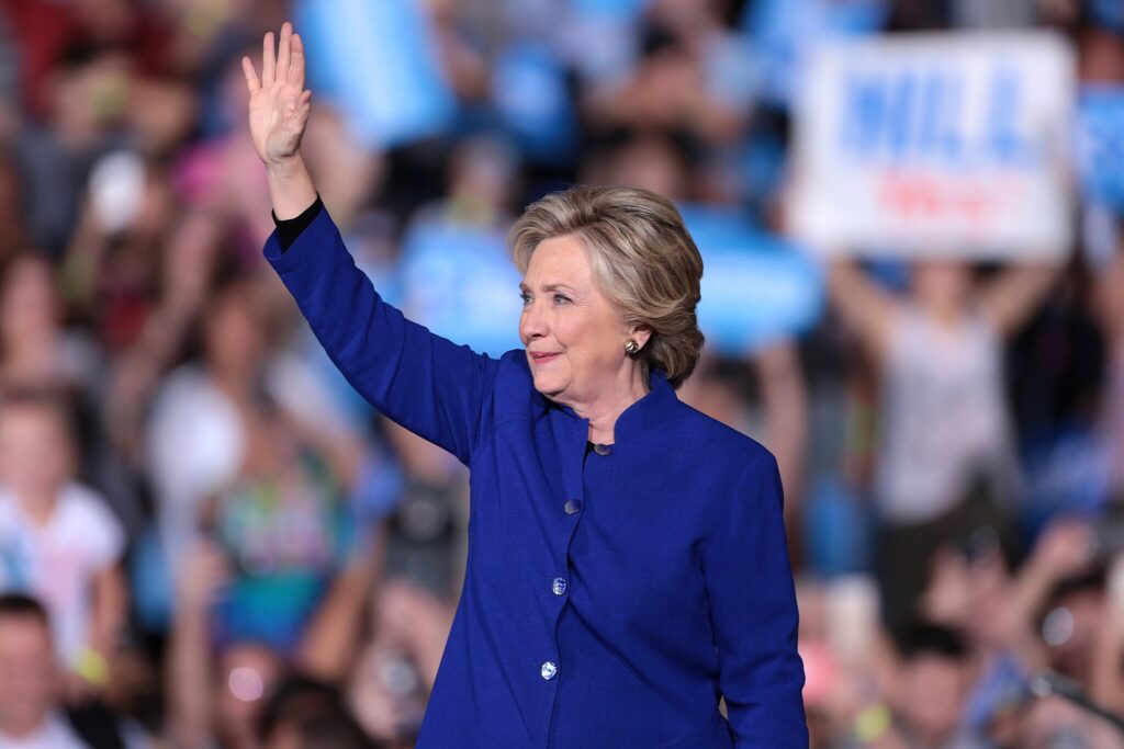 Hillary's Back To Harass Trump - Woke Polls